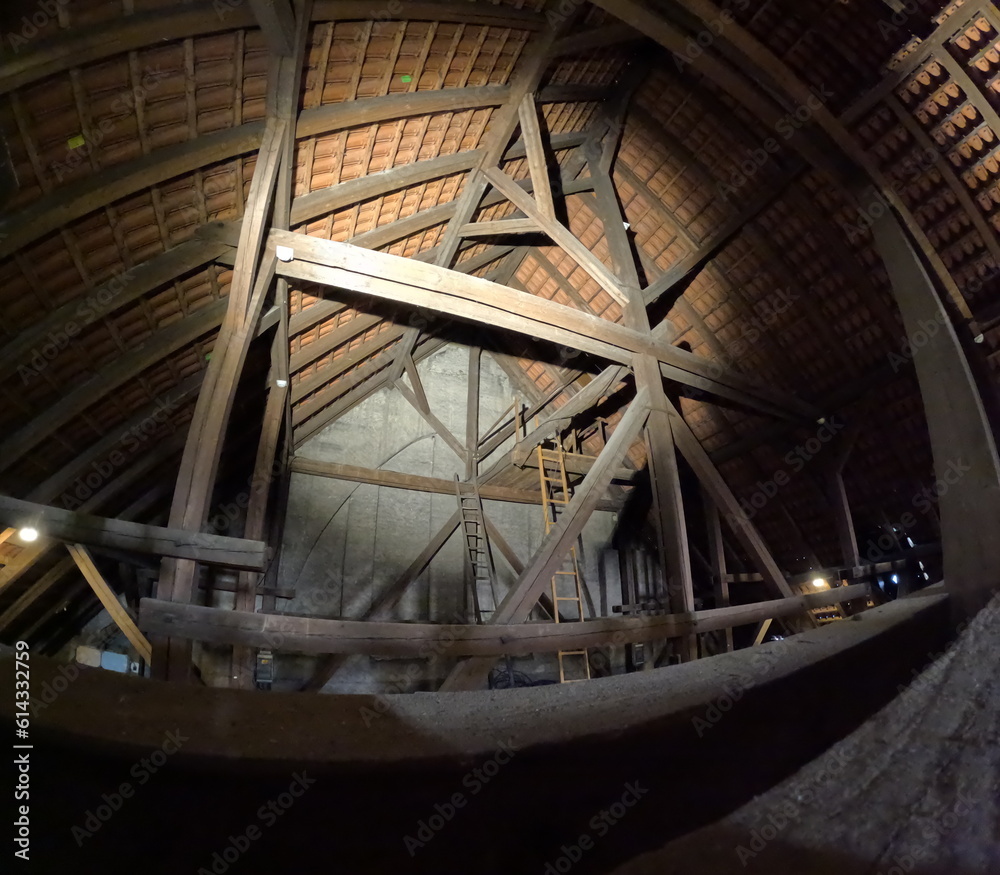 Wooden trusses supporting the roof of an old Gothic church, showcasing ...