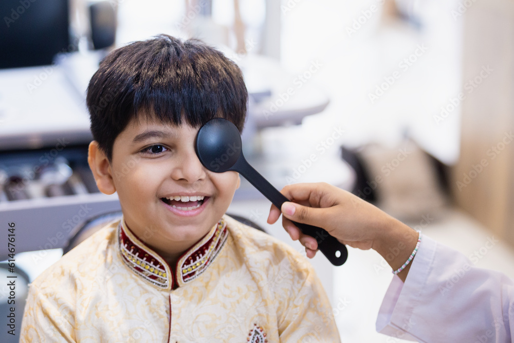 Indian boy examining eyesight checkup vision farsightedness examines ...