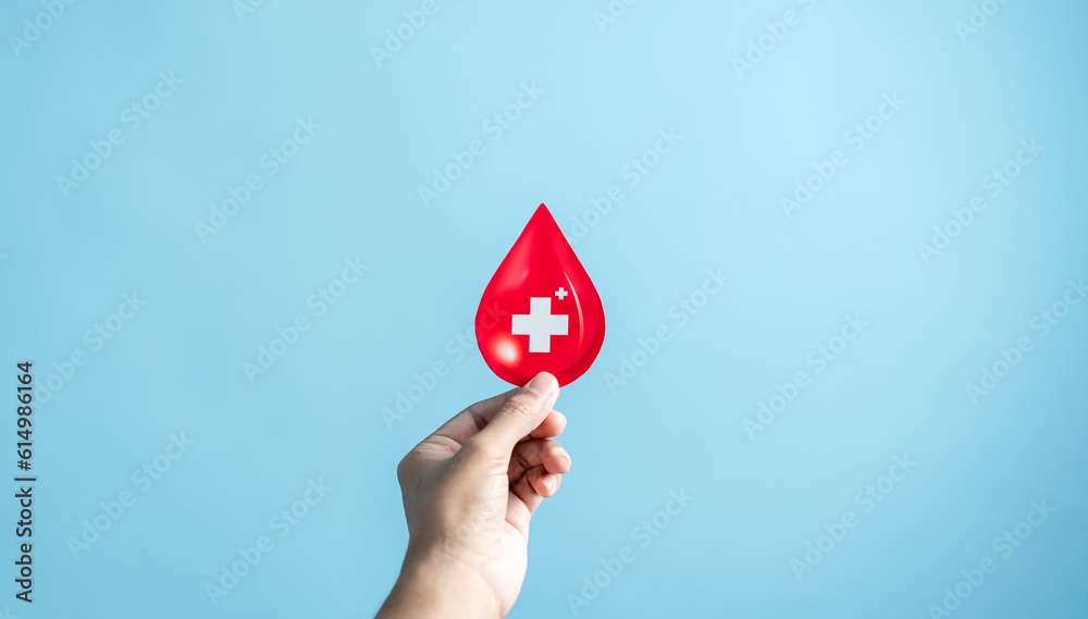 Hands holding blood drop paper cut, blood transfusion, world blood ...