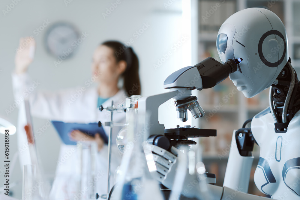 Scientist and robot working together in the lab Stock Photo | Adobe Stock