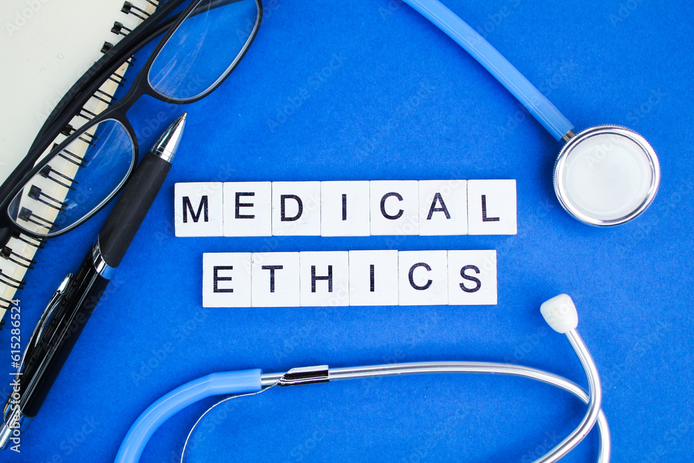 stethoscope, pen and glasses with the word Medical Ethics. concept of ...