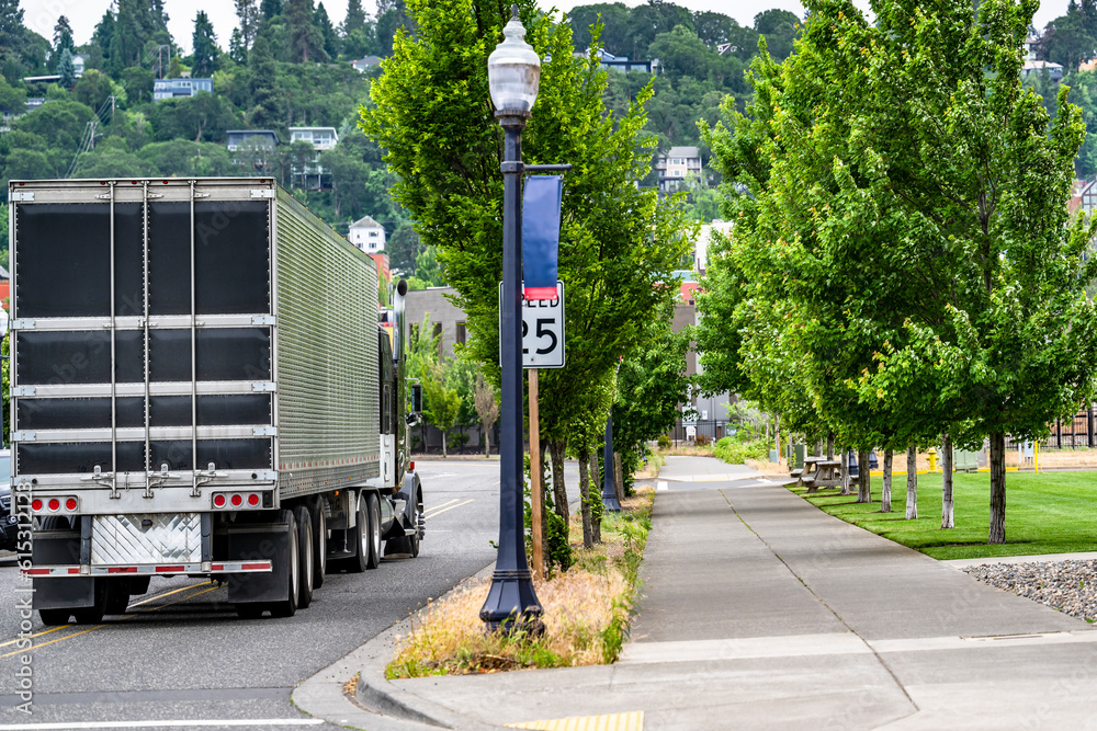 Stylish black and white classic big rig semi truck with corrugated ...