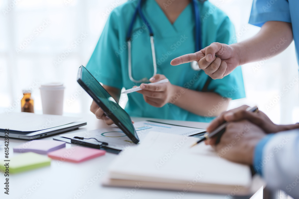 Successful medical doctors discussing diagnosis during the meeting ...