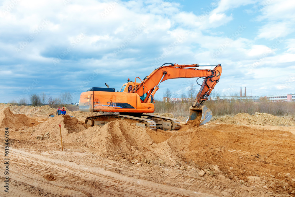 Excavator dig the trenches at a construction site. Trench for laying ...