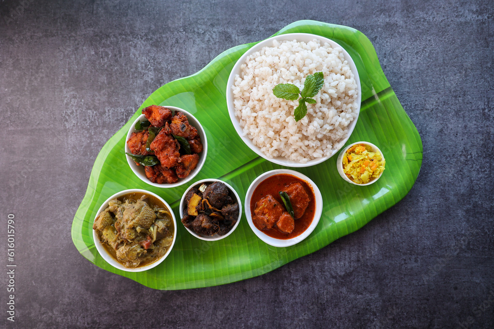 Kerala special food sadhya in banana leaf plate with Chicken fry Duck ...