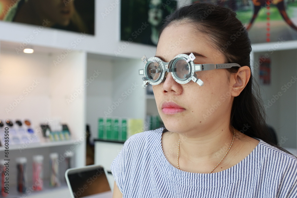 person with glasses, Eye exam concept, woman eye test in clinic ...