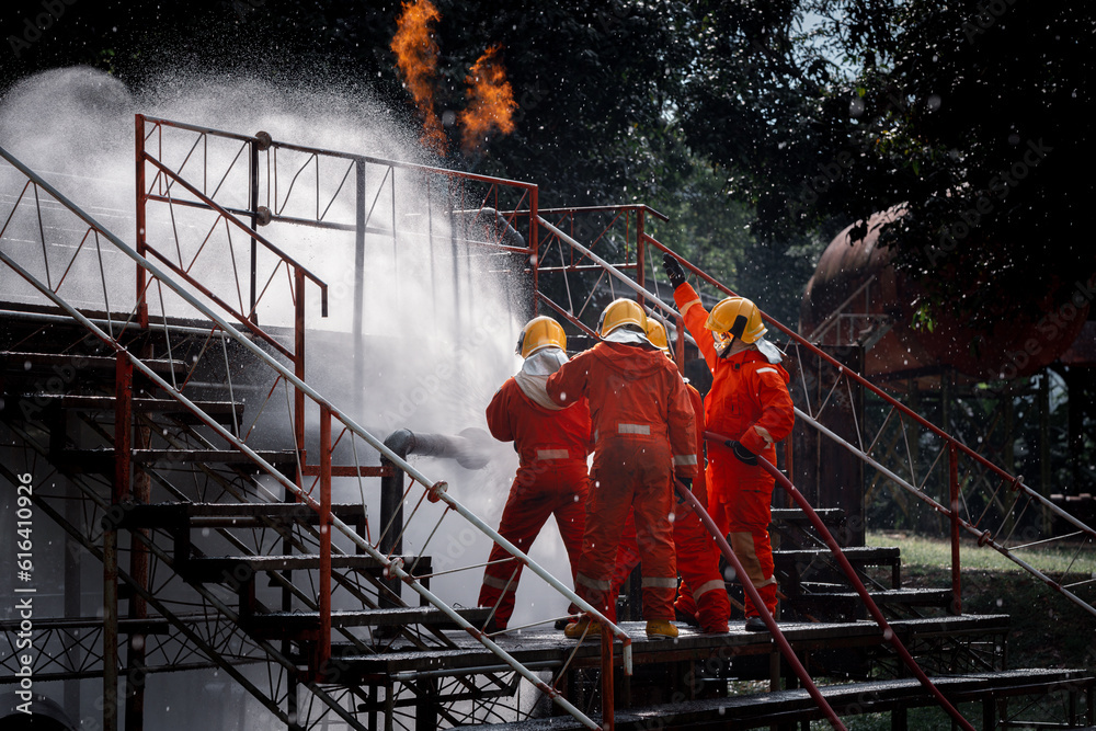 Firefighters safety using twirl water fog type fire extinguisher to ...