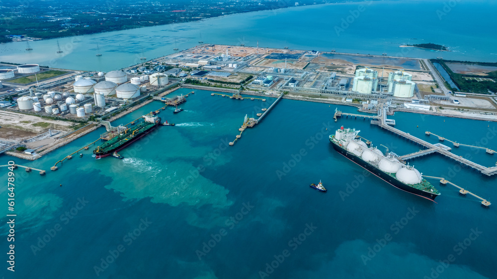 LNG (Liquified Natural Gas) tanker anchored in Gas terminal gas tanks ...