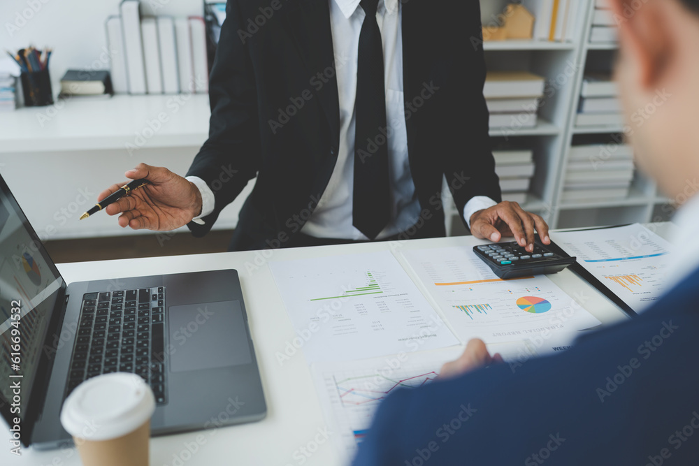 team work process Business team use calculator to calculate figures ...