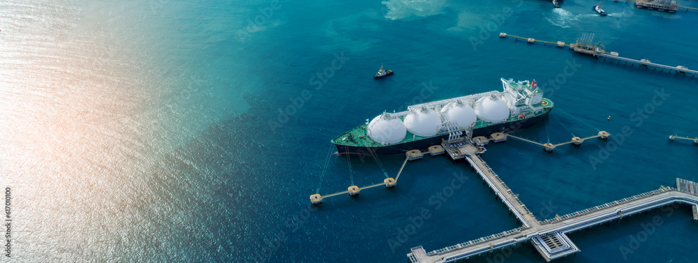 LNG (Liquified Natural Gas) tanker anchored in Gas terminal gas tanks ...