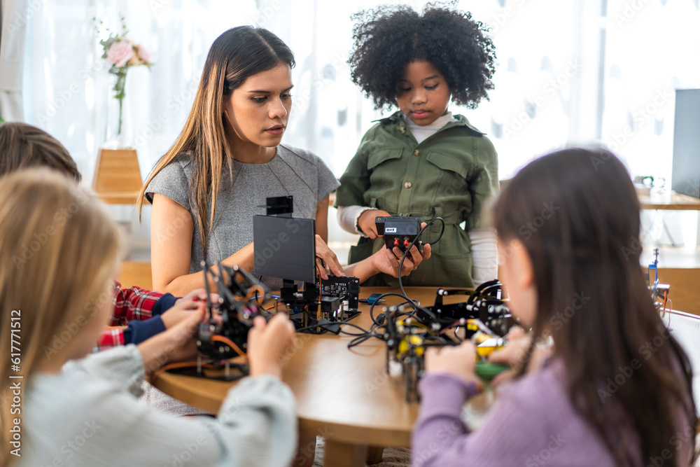Portrait happy teacher help school children student having fun activity ...