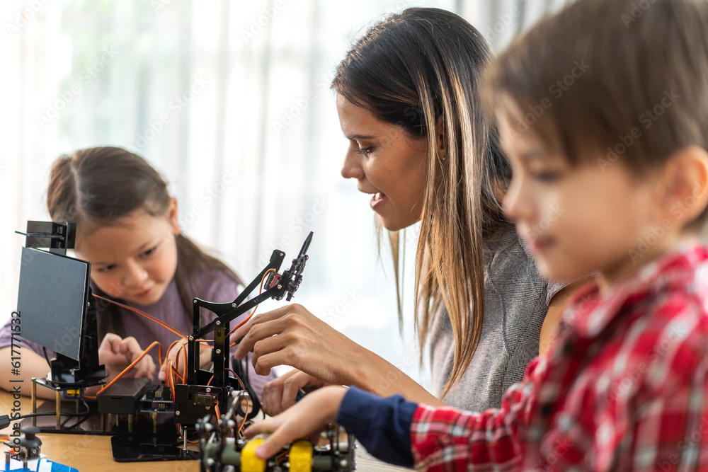 Portrait happy teacher help school children student having fun activity learn training play ...