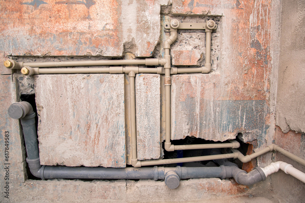 Transfer of water pipes and sewerage drain in the wall. Bathroom ...