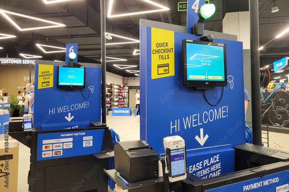 PENANG, MALAYSIA - 18 JUNE 2023: Interior view of Decathlon quick checkout counter in Penang ...