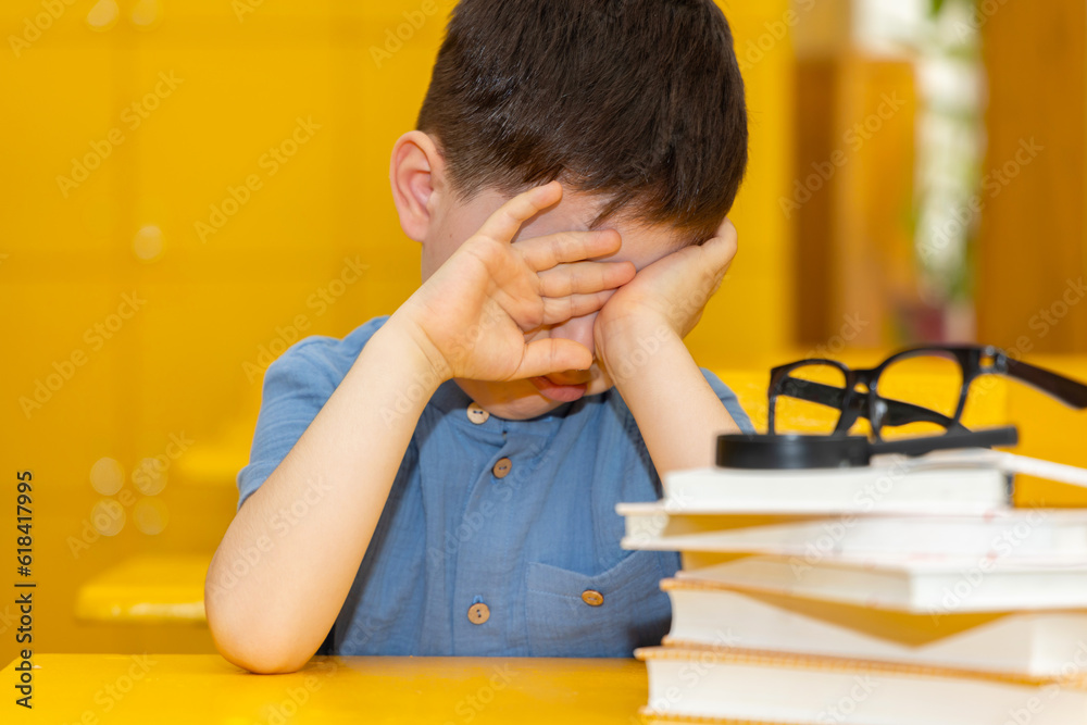 cute preschooler boy crying in classroom or outside with backpack in ...