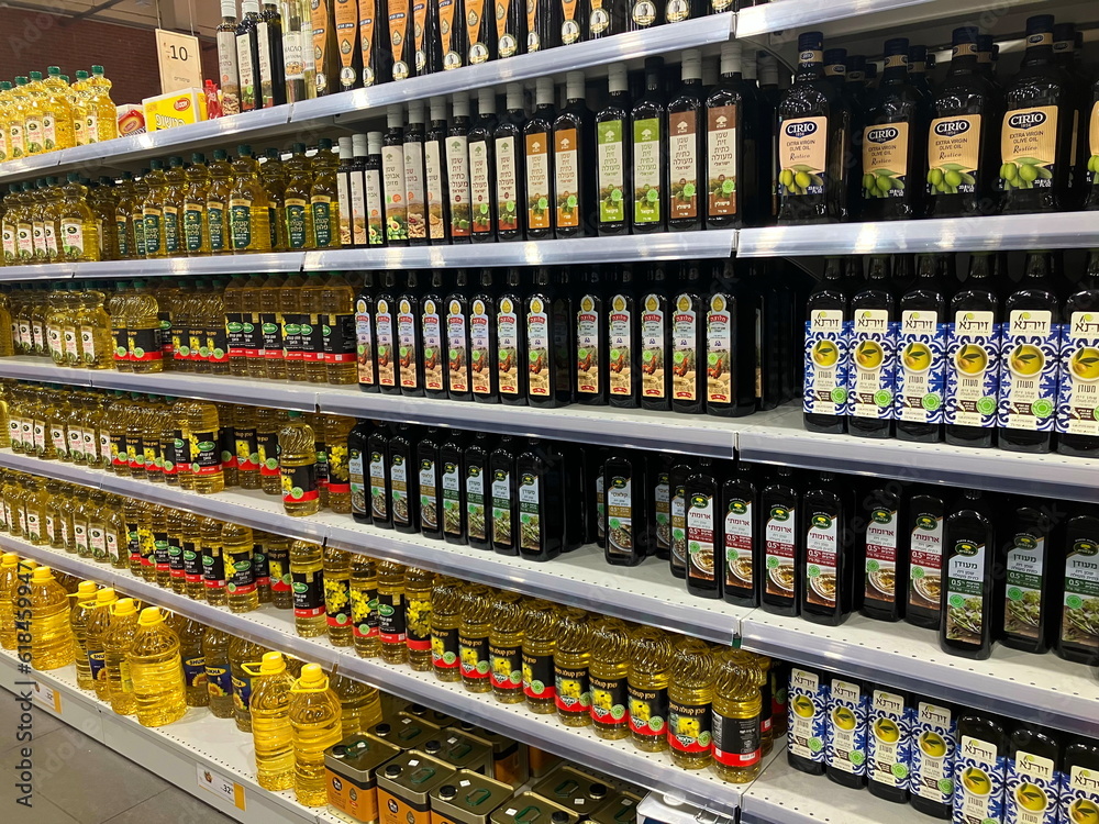 Israeli supermarket. Showcase with a variety of sunflower oil, canola ...