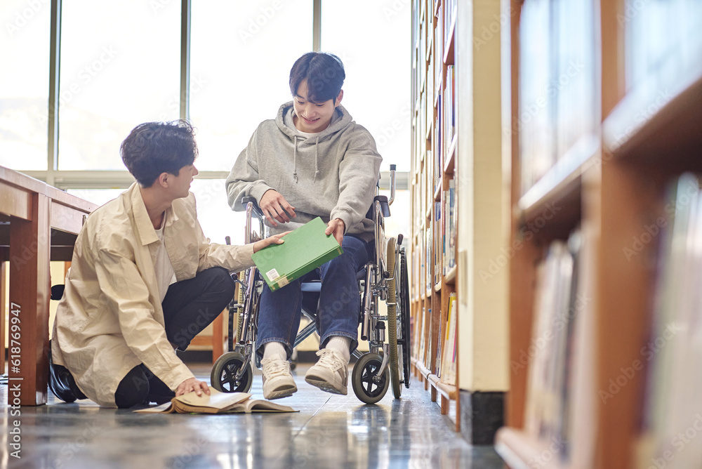 Young handicapped disabled male college student model in wheelchair ...