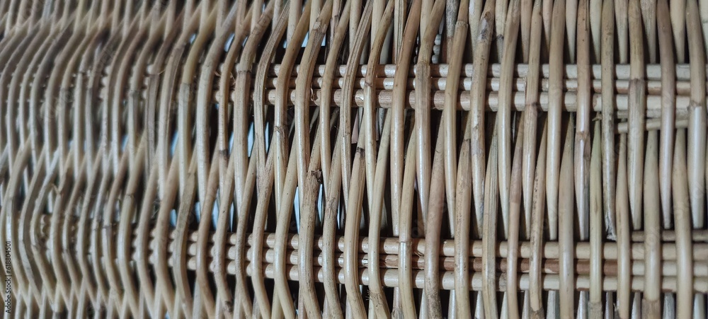 The rattan background image is woven into a pattern of colors that look ...