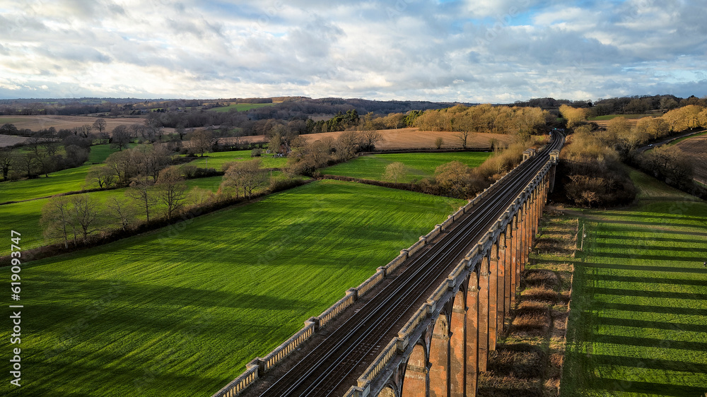 Aerial photo of Ouse Valley Viaduct, a long and curved railway bridge ...