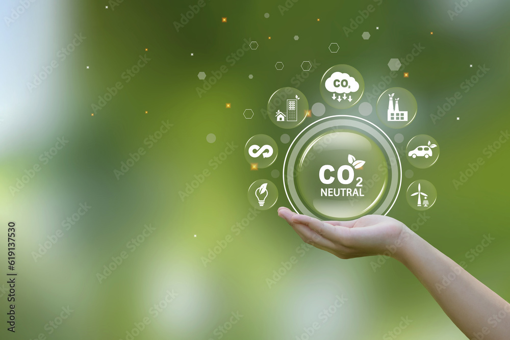 Foto de Stock Hand holding bubbles with Co2 neutral icon, Reduce CO2 emissions to limit climate ...