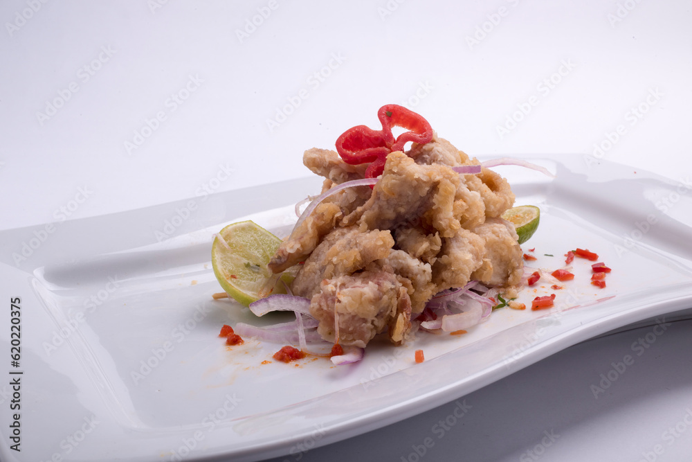 chicharon breaded fried fish and corn, aji with symbol dish of Peruvian ...