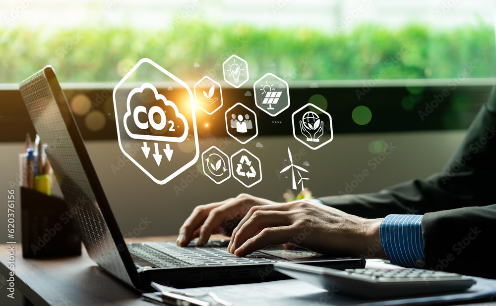 CO2 emission reduction concept, businessman with environmental ...