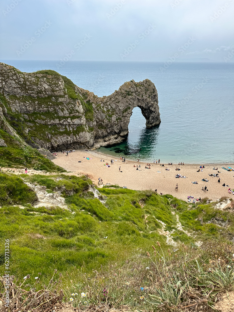 Dorset, UK. Hot summer day at Durdle Door limestone arch on the ...