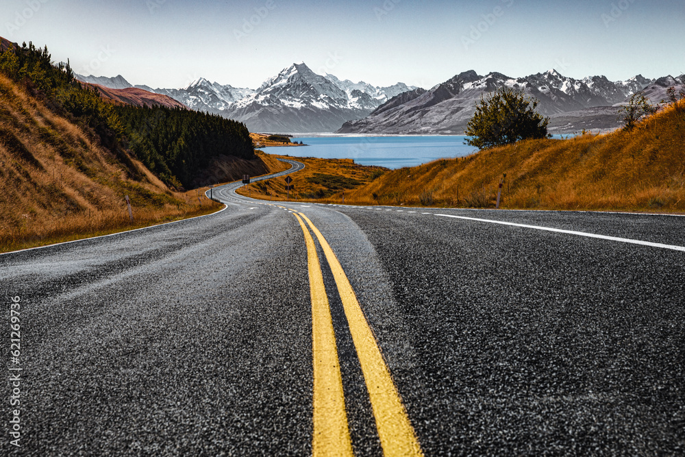 Asphalt road to mount cook on the south island of New Zealand in very ...