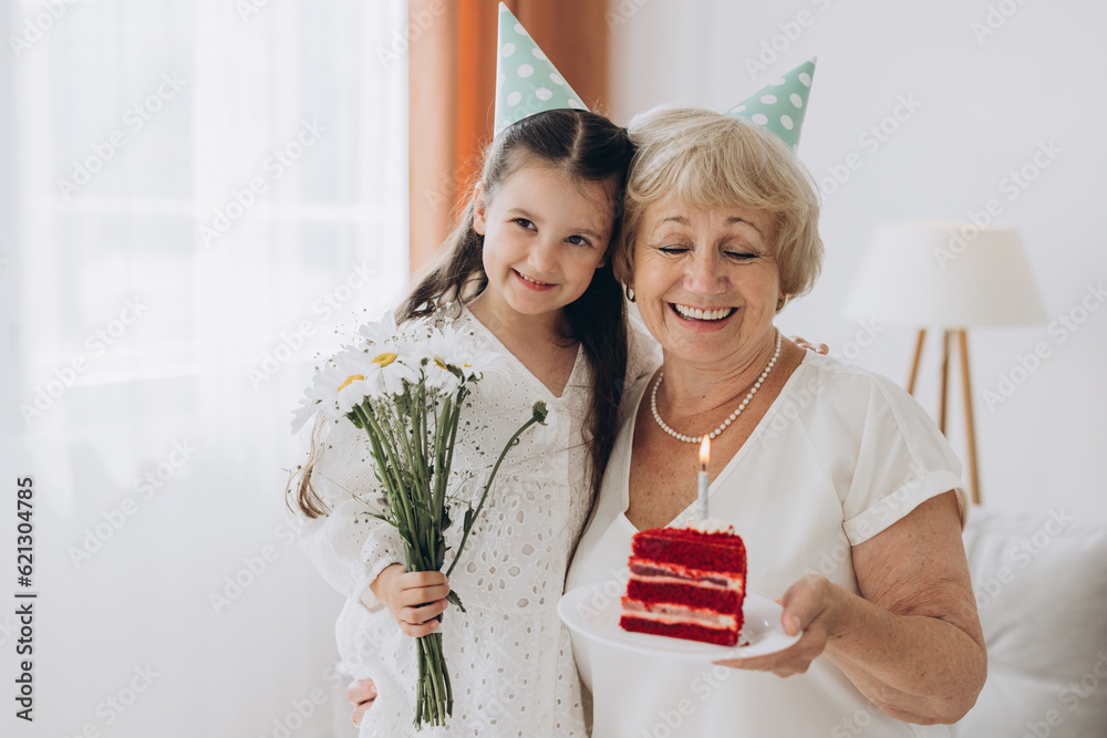 Happy smiling grandmother receives birthday greetings from ...