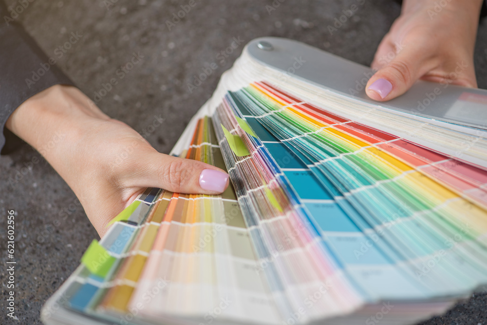 Home repairs. Choice of wall paint colors. The designer selects a color ...