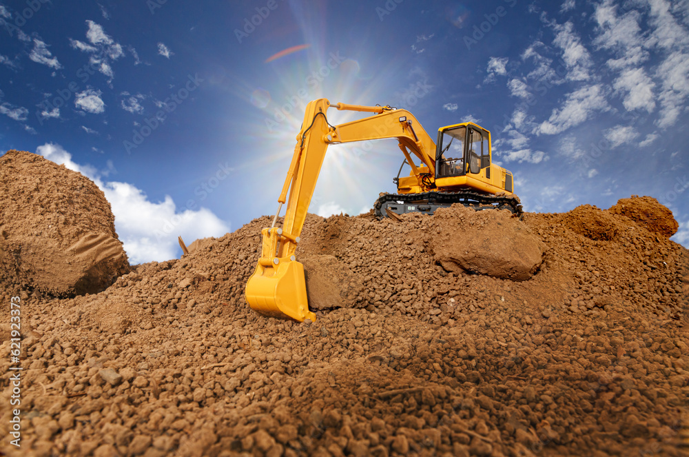 Crawler excavators are digging soil at construction site . on clouds ...