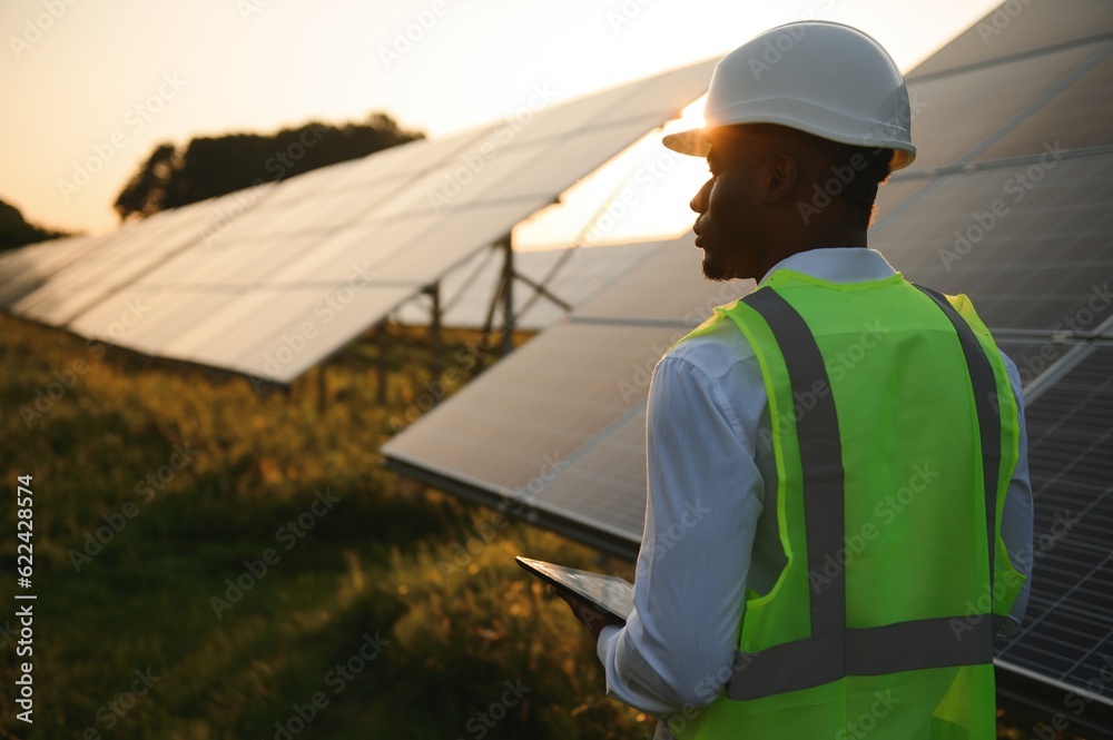 African american technician check the maintenance of the solar panels ...