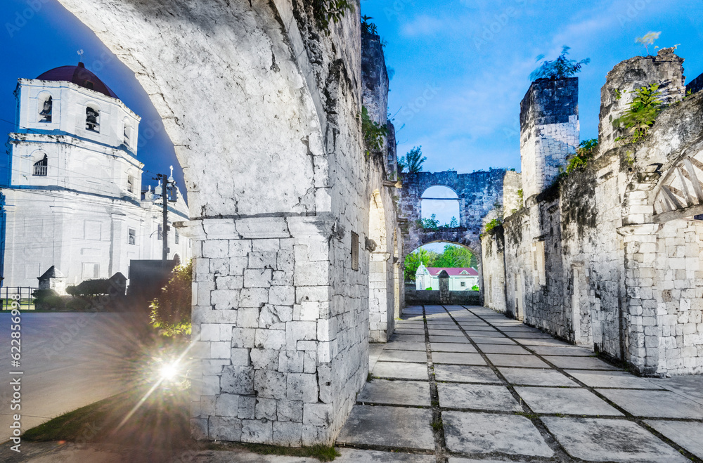The Cuartel Ruins,lit by artificial light as night approaches,Oslob ...