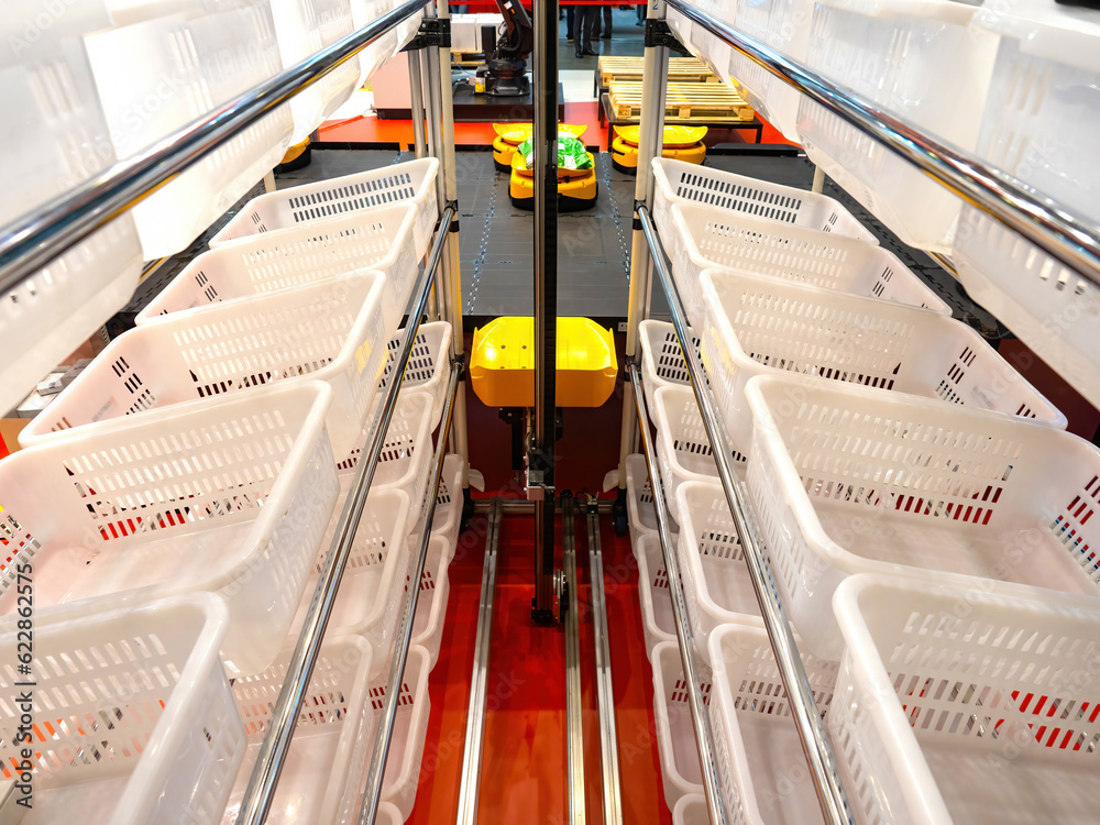 Fotografie Warehouse technologies. Yellow autonomous mobile robot ...