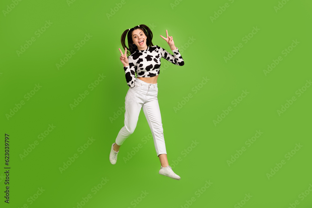 Full length photo of cool excited lady wear cow skin shirt jumping high ...