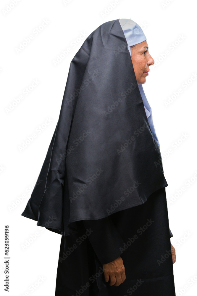 Middle age senior christian catholic nun woman over isolated background ...