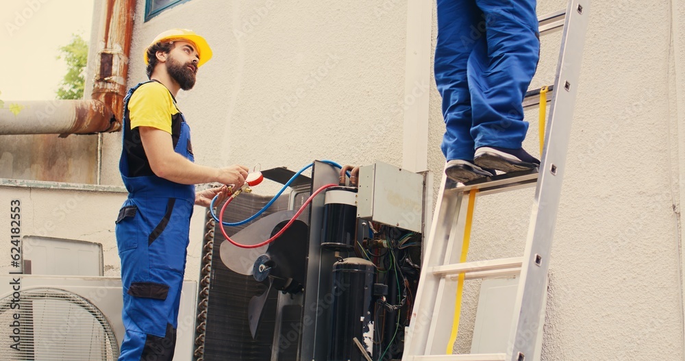 Proficient expert holding electric power drill stepping down from ...