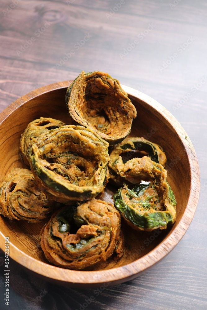 Dry Patra is an Indian dish made with colocasia leaves that are coated ...