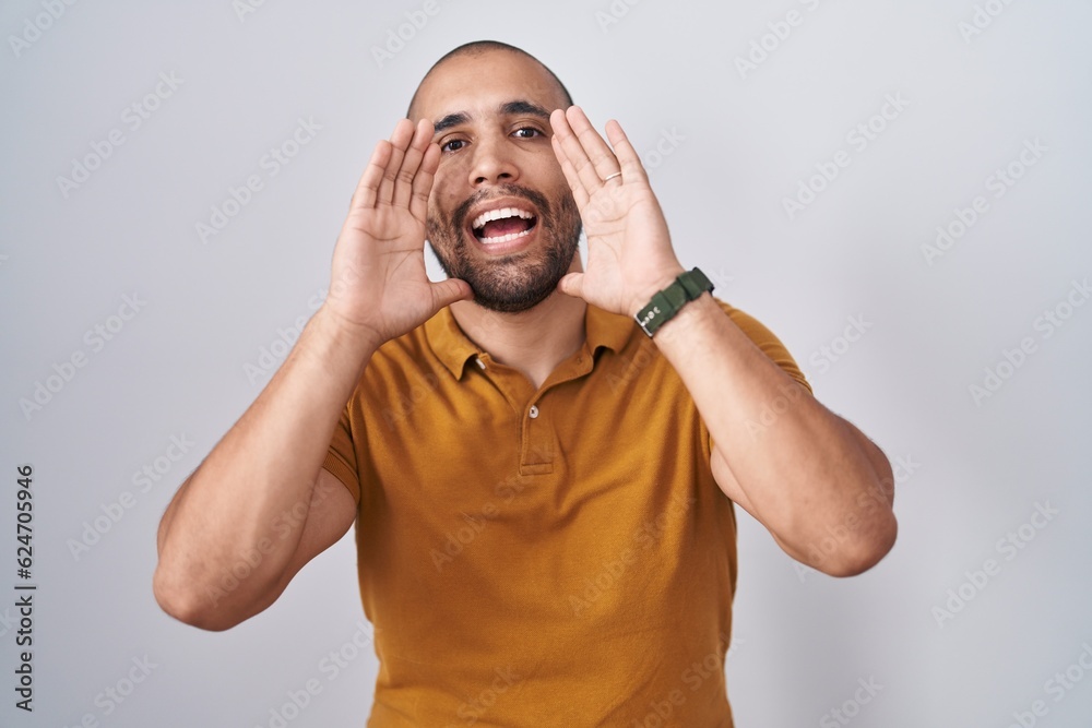 Hispanic man with beard standing over white background smiling cheerful ...