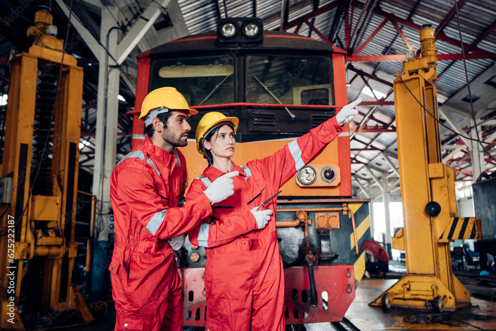 Team of engineer railway wearing safety uniform and helmet under ...