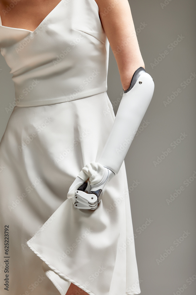 Foto de Stock Cropped studio portrait of a young girl with disability ...
