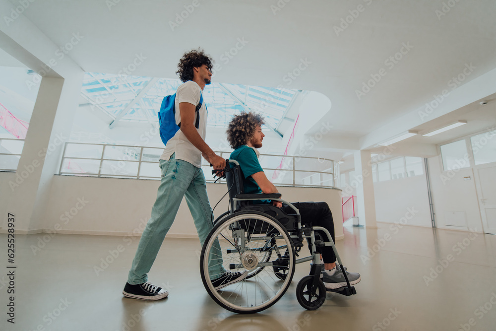 African American student pushing his friend's wheelchair through a ...