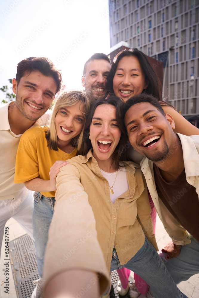 Vertical selfie of a Group of happy multiracial friends having fun ...