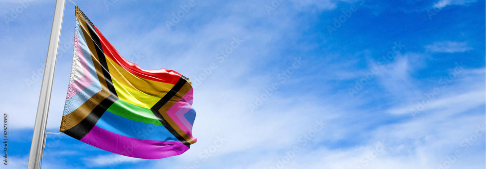Bi Inclusive Unity flag waving in the wind at cloudy sky. Freedom and ...