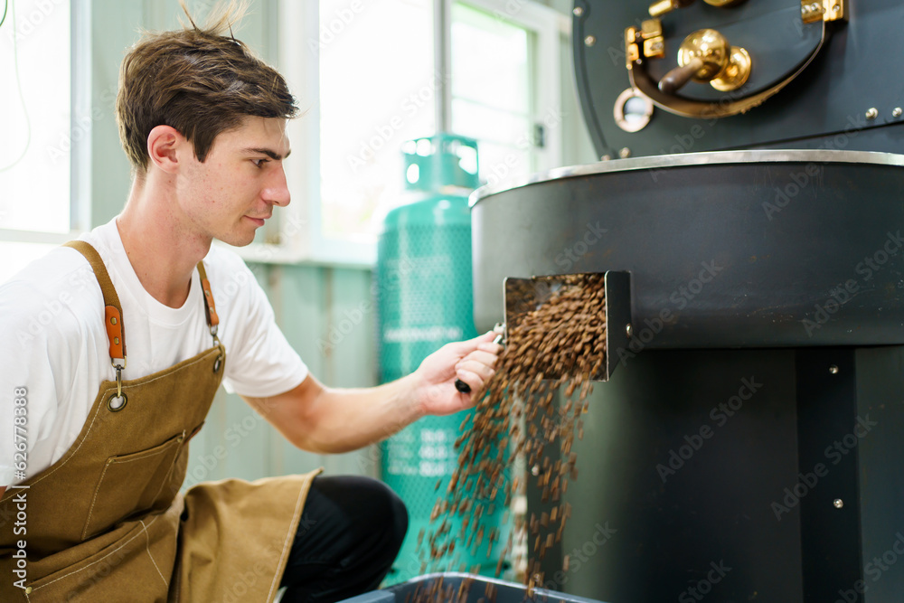 Professional male and female coffee roasters working with modern ...