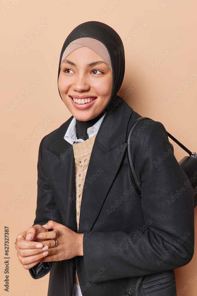 Joyous Muslim businesswoman shines and radiates happiness and success ...