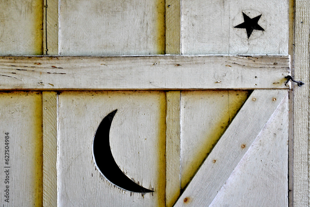 Star for “Men” and crescent moon for “Women” designate outhouse gender ...