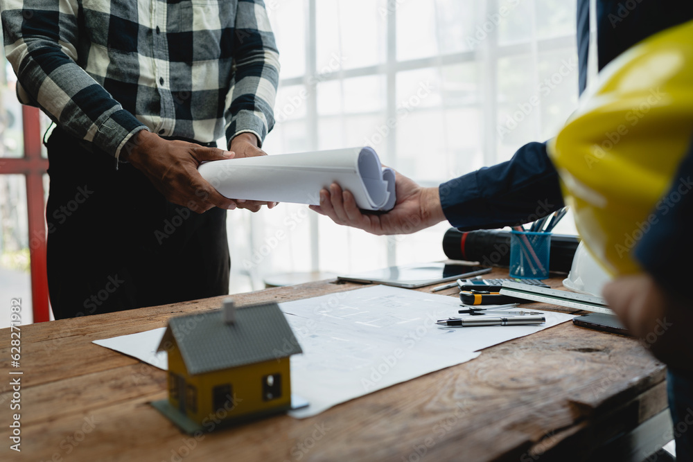 Architects and engineers work together in business, submitting ...