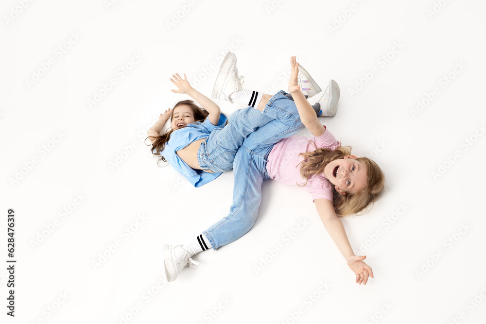 Group portrait of kids girls friends on white studio background. Happy ...
