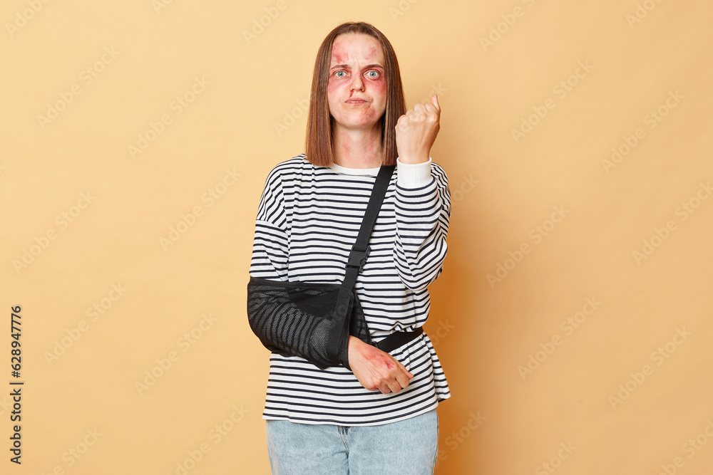Angry sick woman with scratches and bruises on her face standing ...